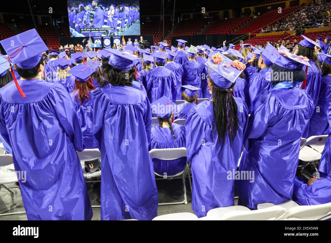 The graduating class of 2024 stands up and applauds at Mesa Community ...