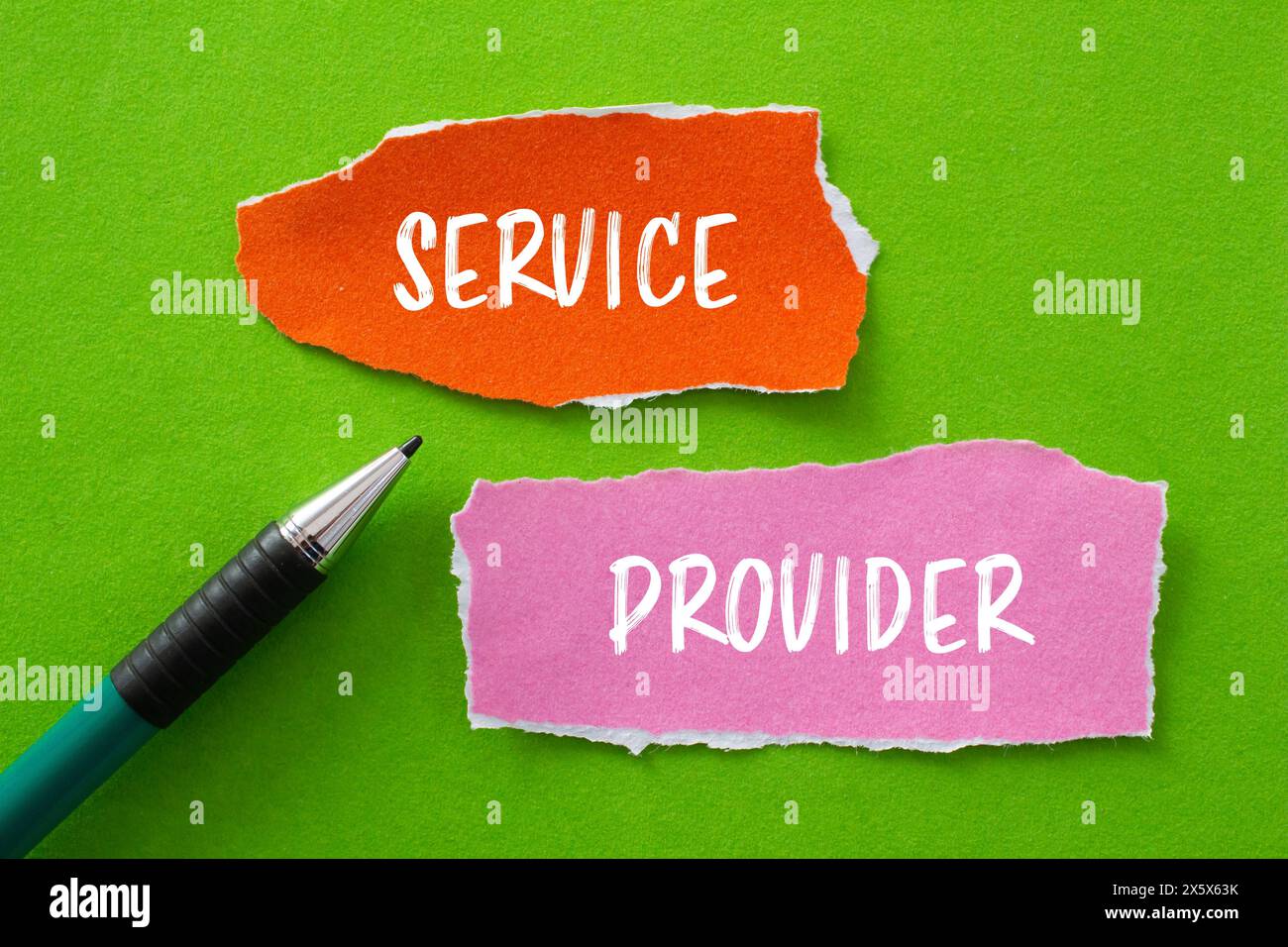 Service provider words written on ripped paper pieces with green ...