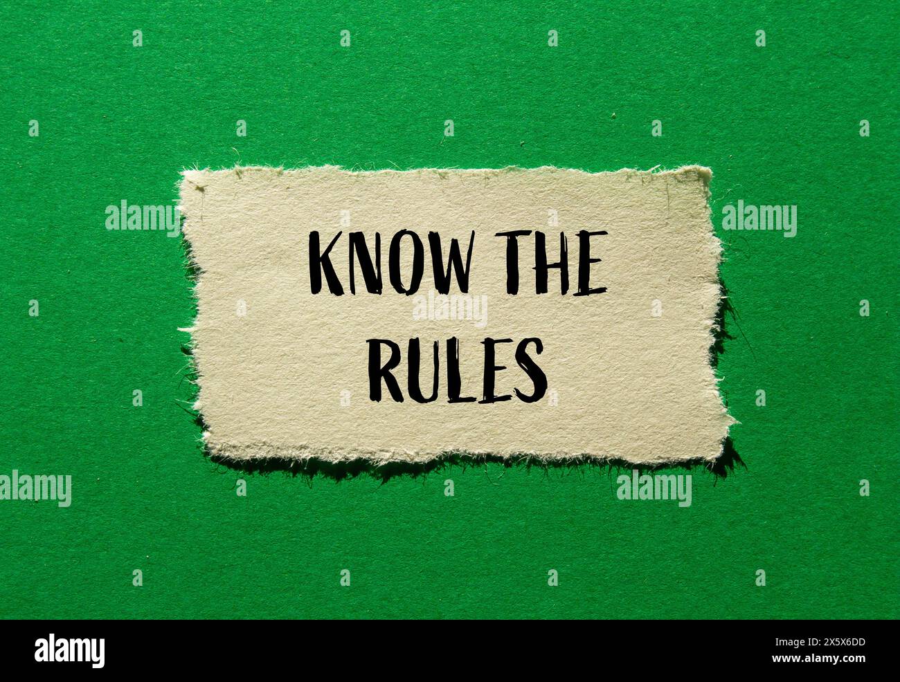 Know the rules words written on ripped paper with green background ...