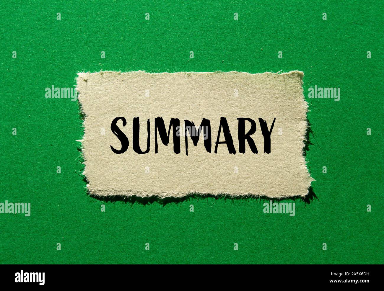 Summary word written on ripped paper with green background. Conceptual ...