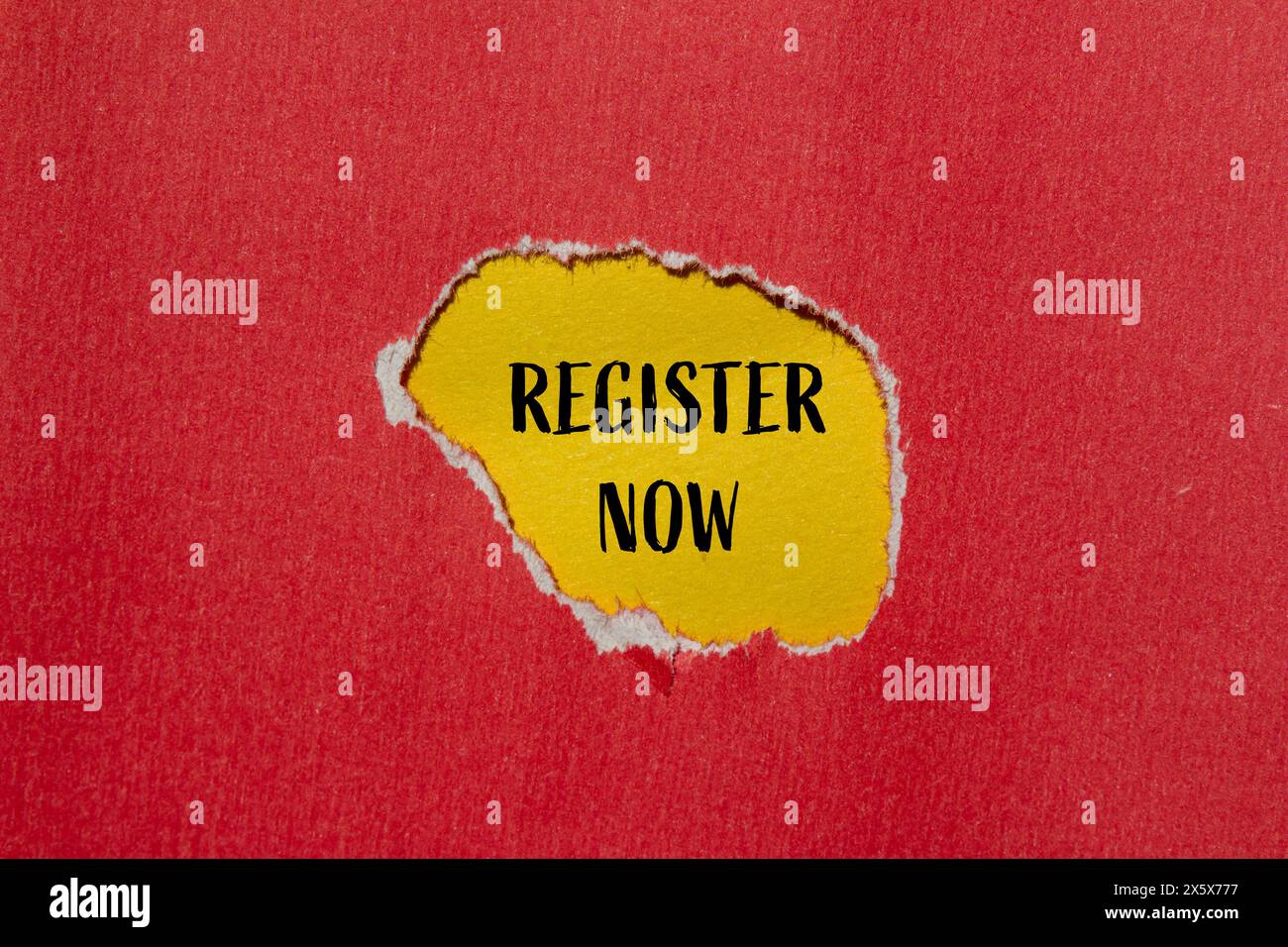 Register now words written on ripped red paper with yellow background ...