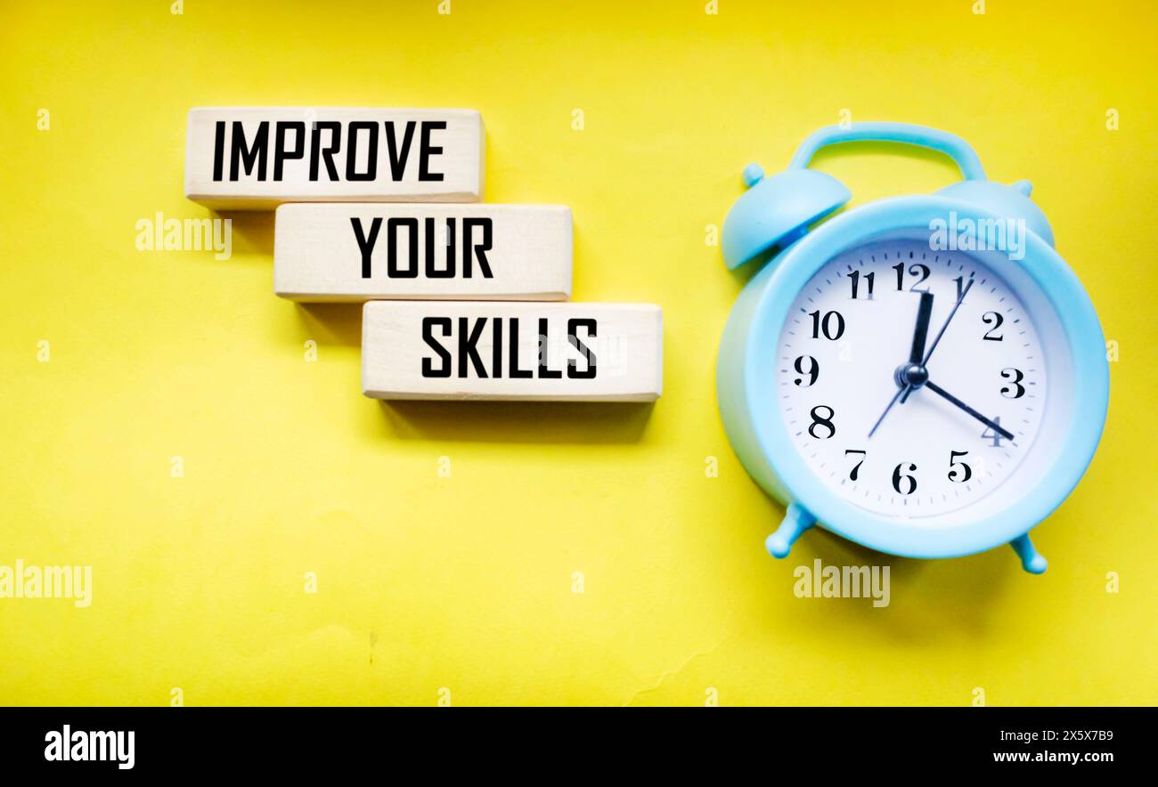 Wooden blocks with the inscription Improve your skills on a yellow ...