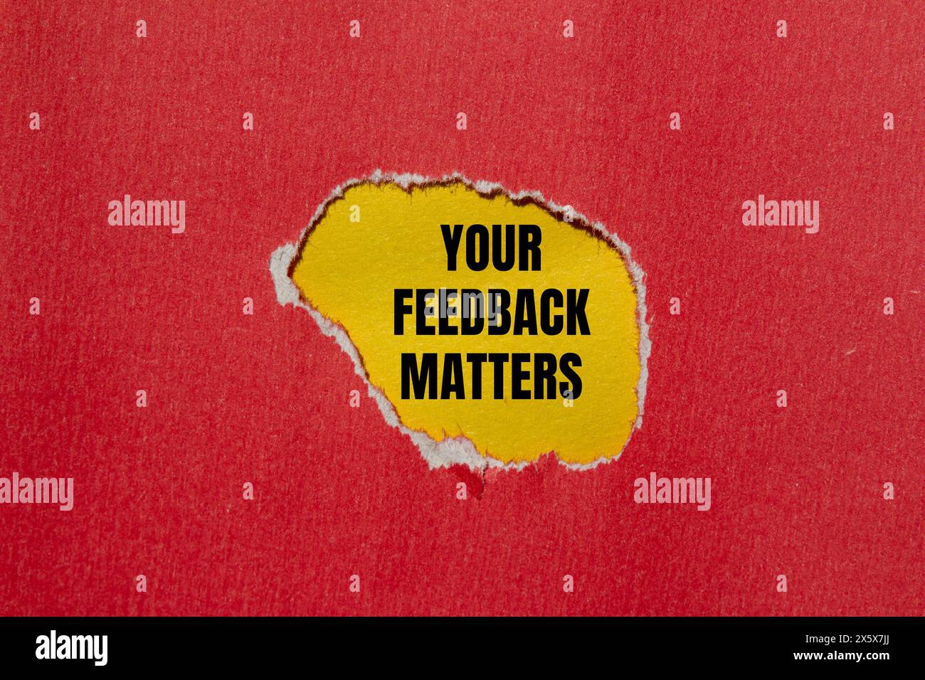 Your feedback matters words written on ripped red paper with yellow ...