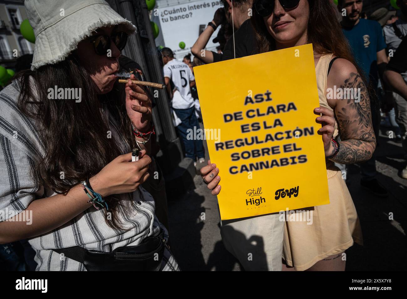 Madrid, Spain. 11th May, 2024. A woman is seen smoking a large joint of ...