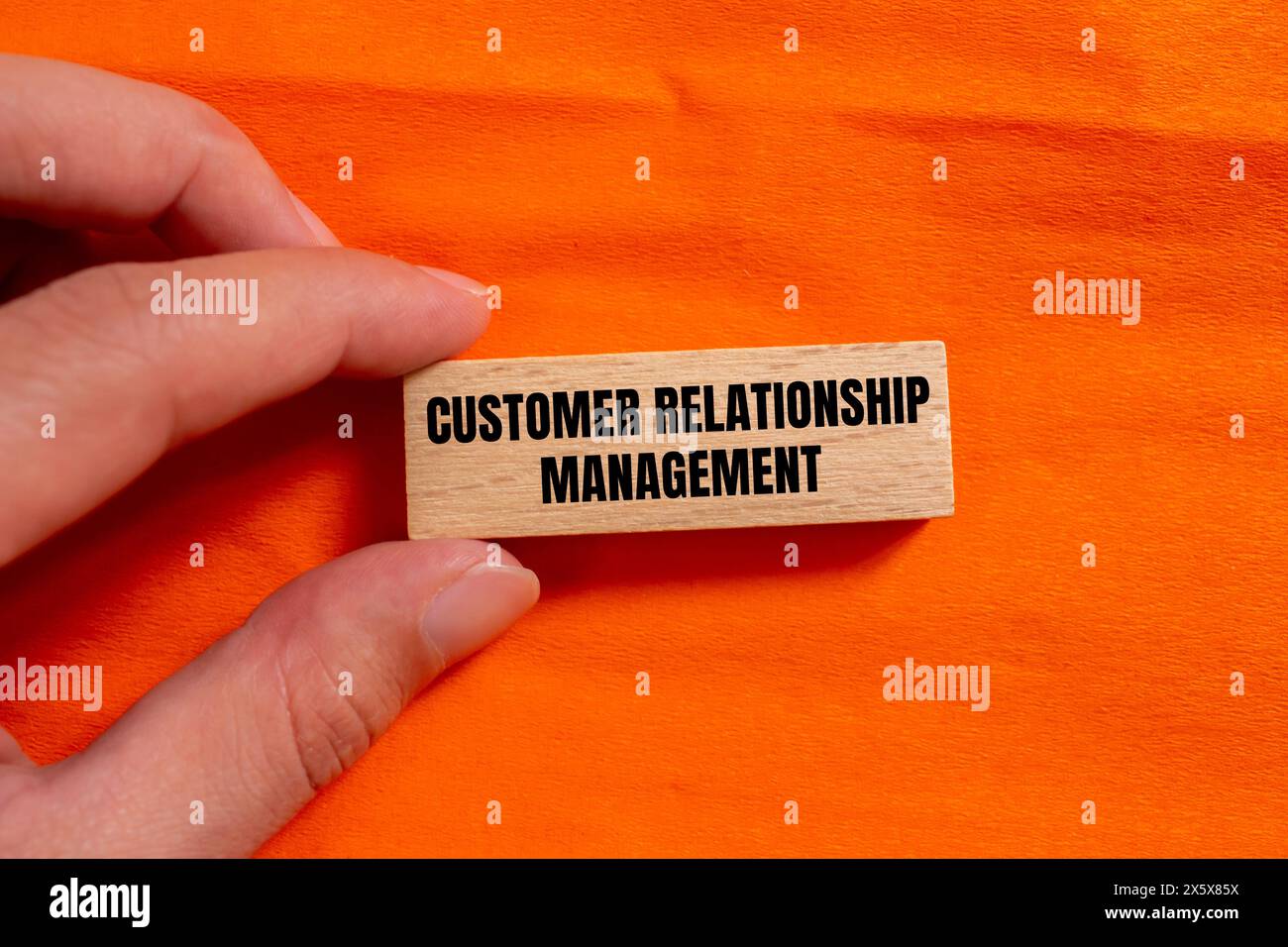 Customer relationship management words written on wooden block with ...