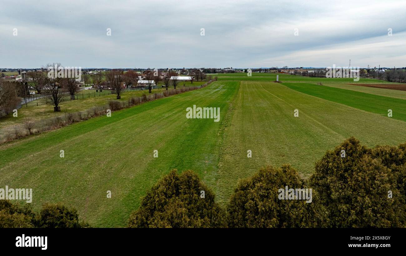 This drone-captured image showcases a vast rural landscape with ...