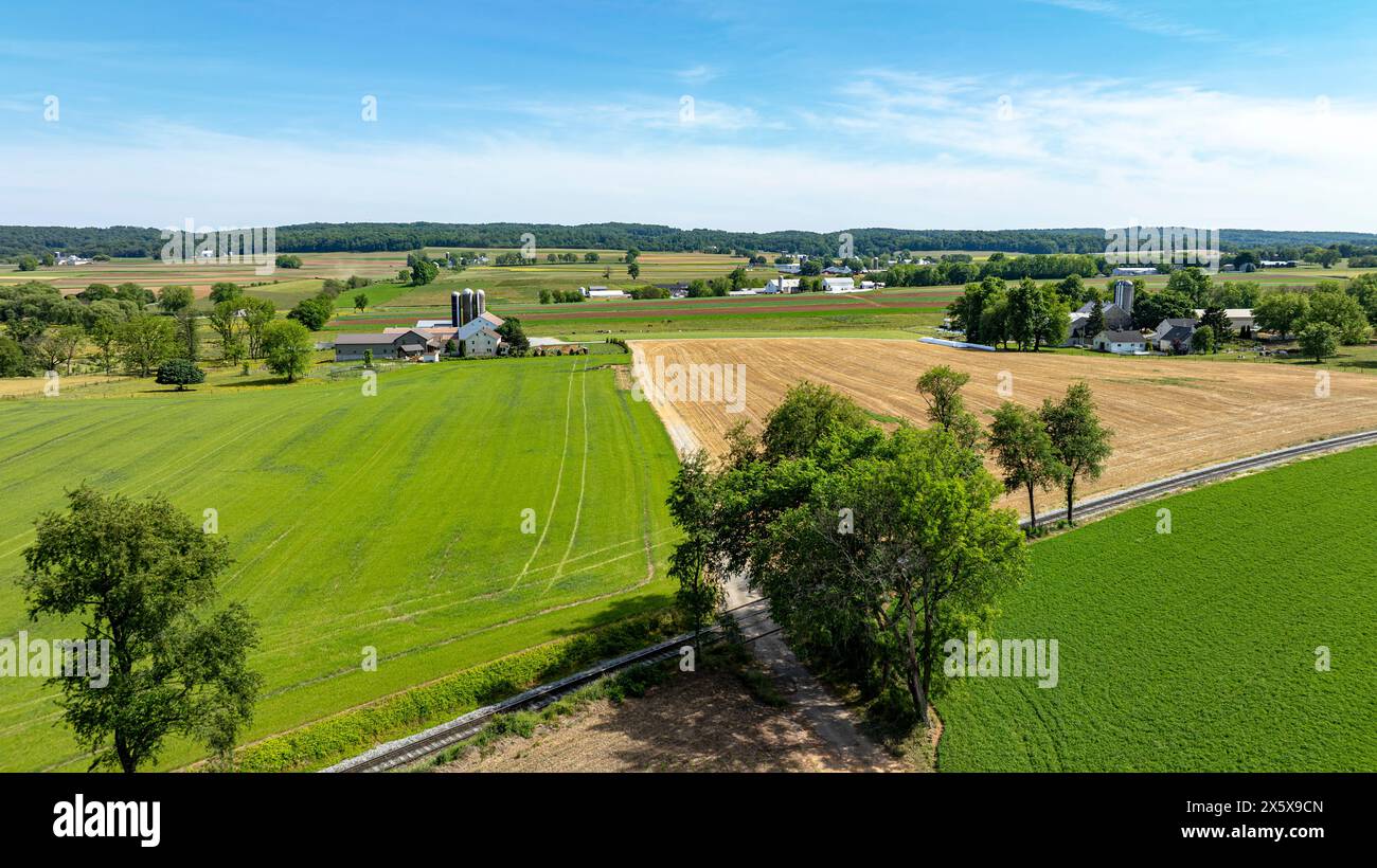 Aerial view capturing a picturesque landscape of mixed-use farm fields ...