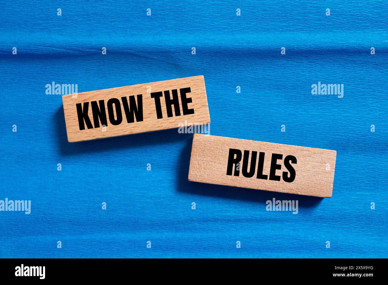 Know the rules words written on wooden blocks with blue background ...