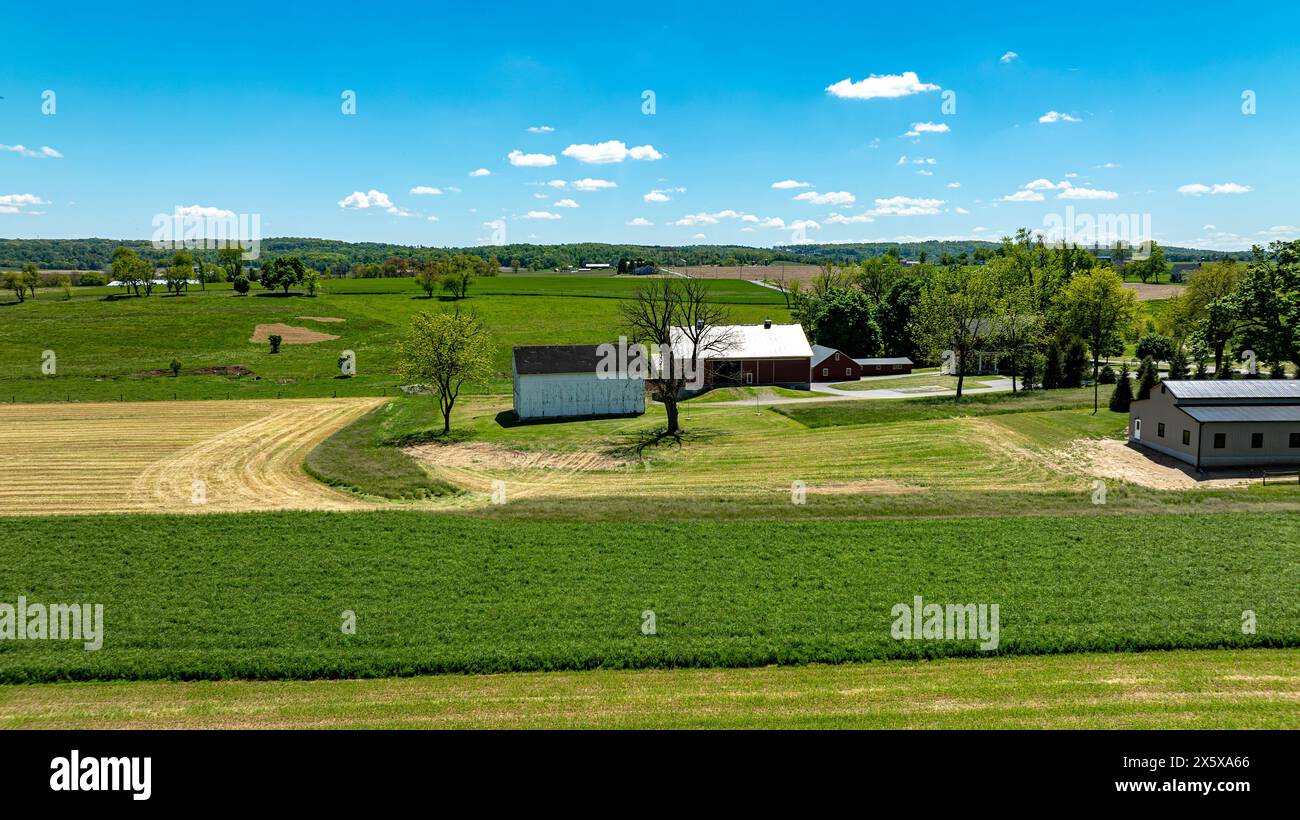An aerial view captures the serene beauty of a farmstead surrounded by ...