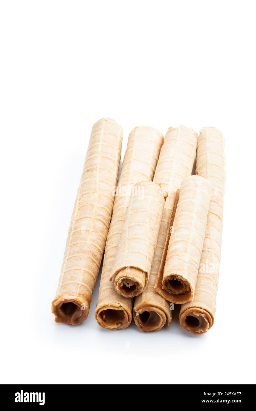 Delicious of waffer rolls with boiled condensed milk isolated on white ...
