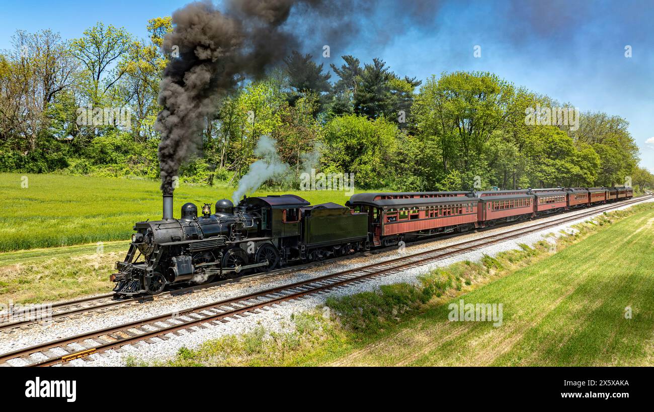 Captivating image of a classic steam train, Number 89, puffing thick ...