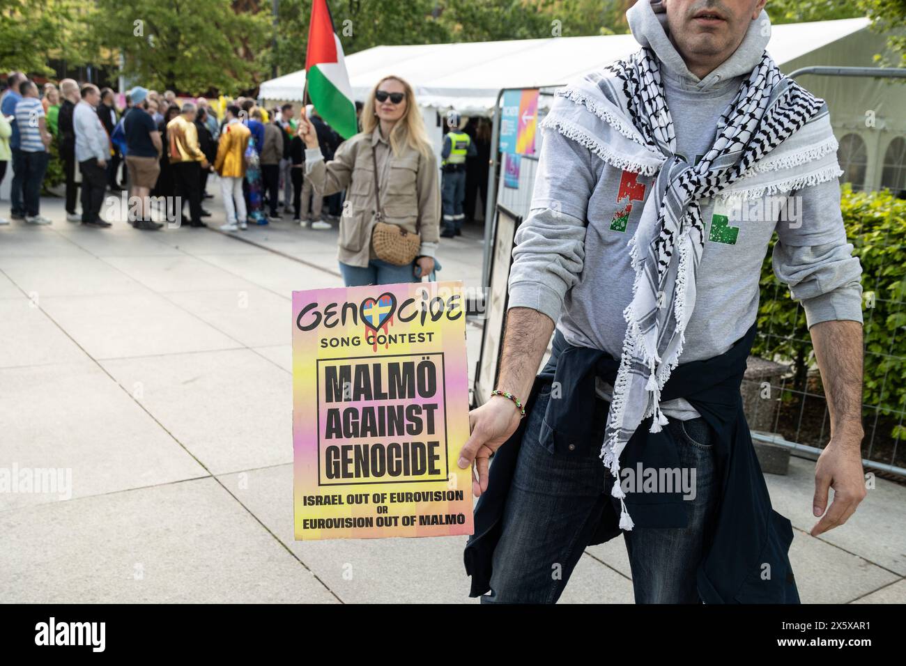 Demonstrators holding flyer and Palestinian flag as people protest ...