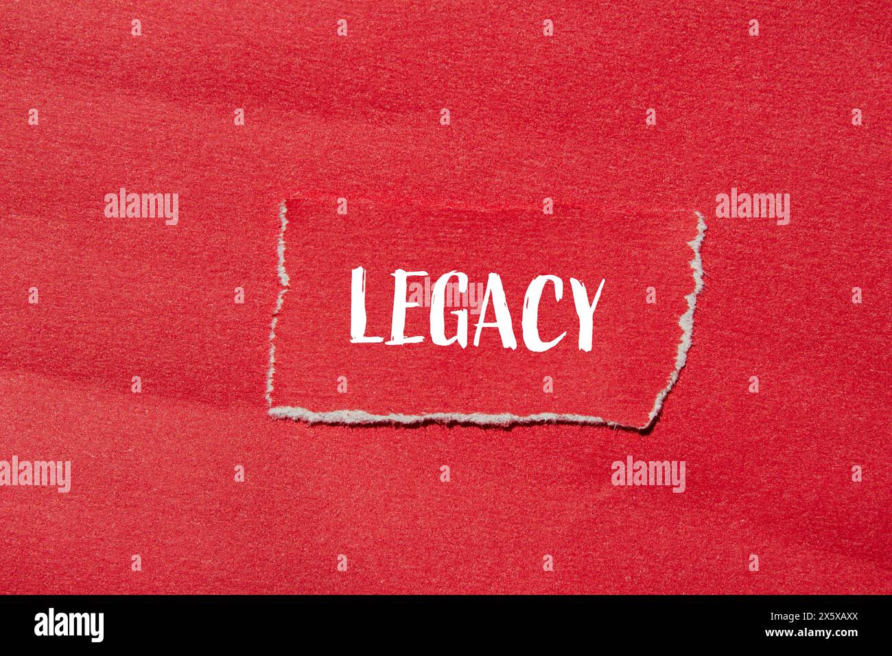 Legacy word written on ripped red paper with red background. Conceptual ...