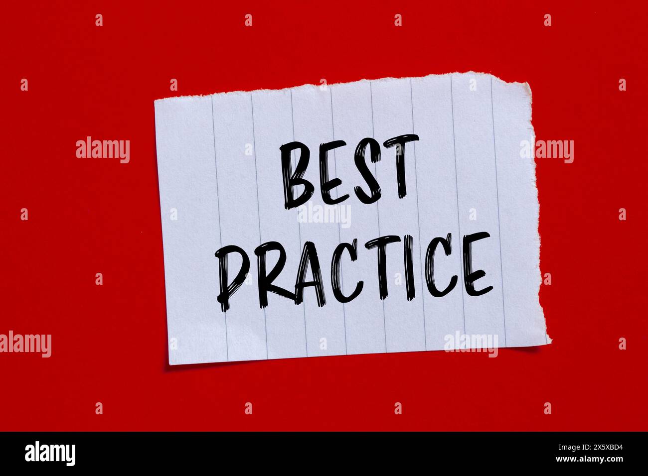 Best practice words written on ripped paper with red background ...