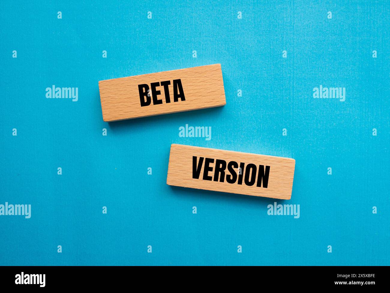 Beta version words written on wooden blocks with blue background ...