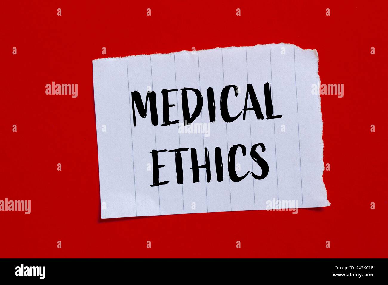 Medical ethics words written on ripped paper with red background ...