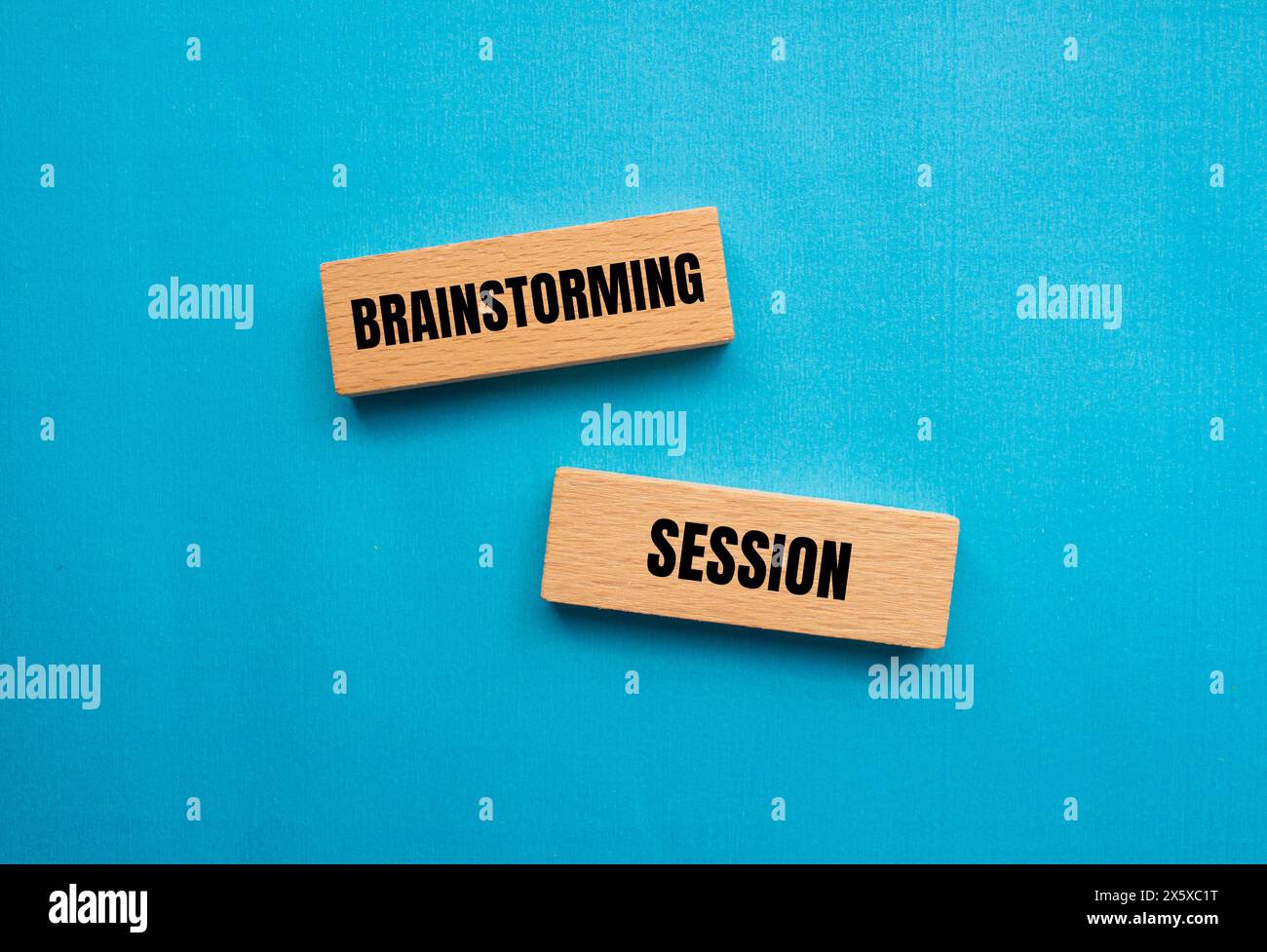 Brainstorming session words written on wooden blocks with blue ... Brainstorming session words written on wooden blocks with blue ...