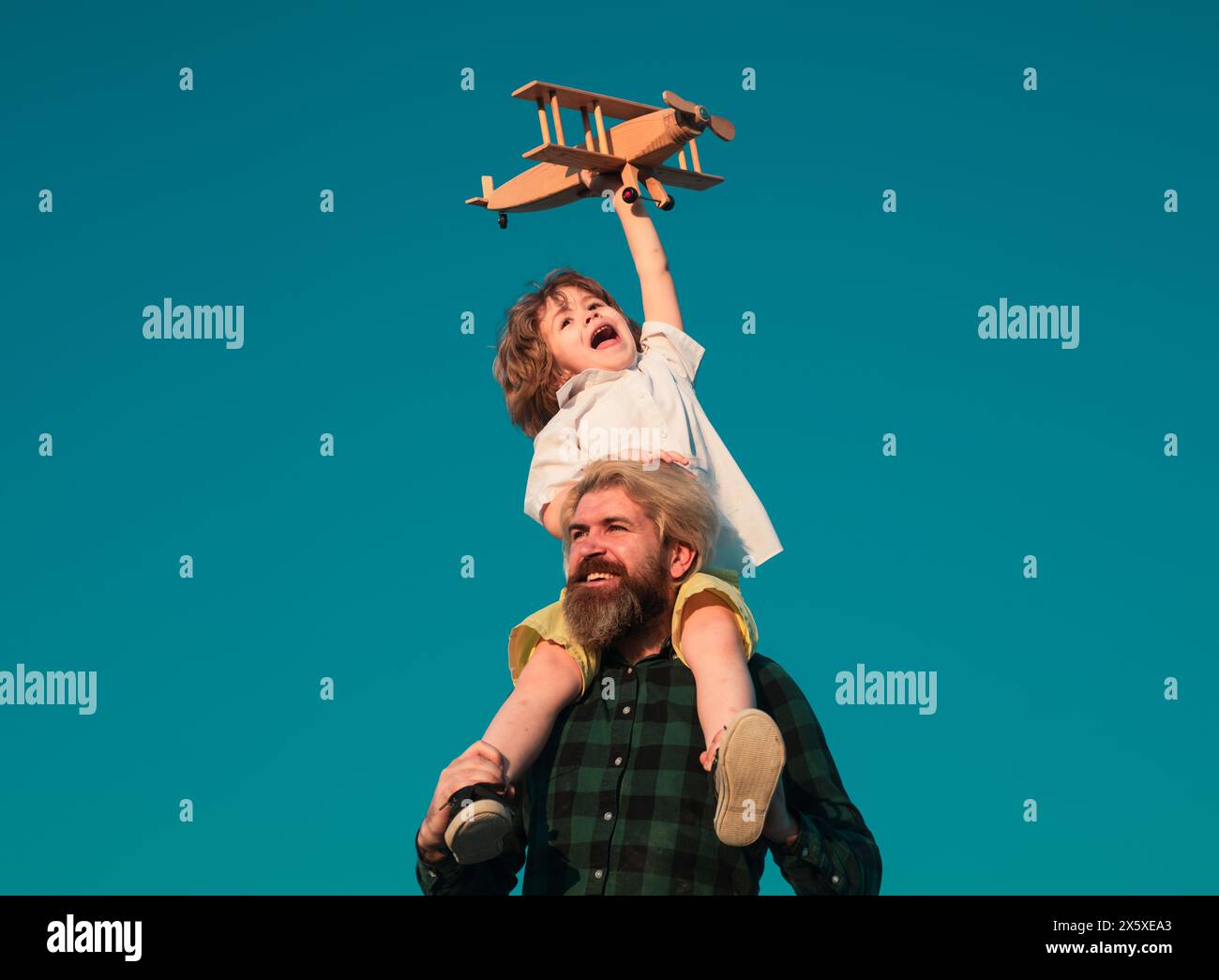 Kid boy pilot. Child son and dad with airplane Stock Photo - Alamy