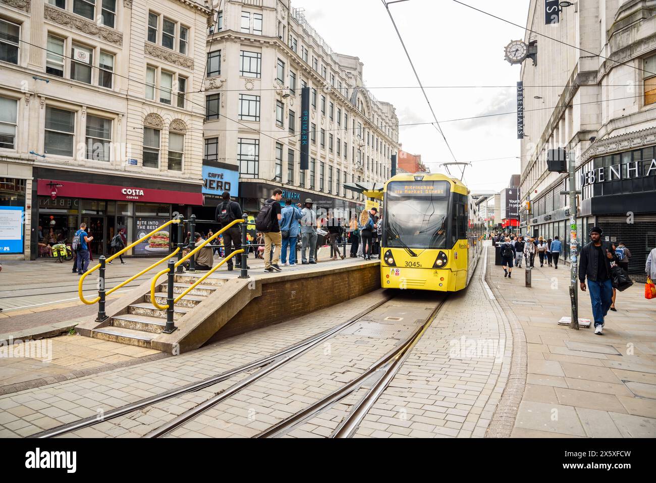 Manchester, UK - July 13, 2023: Tram at the stop in market street, one ...