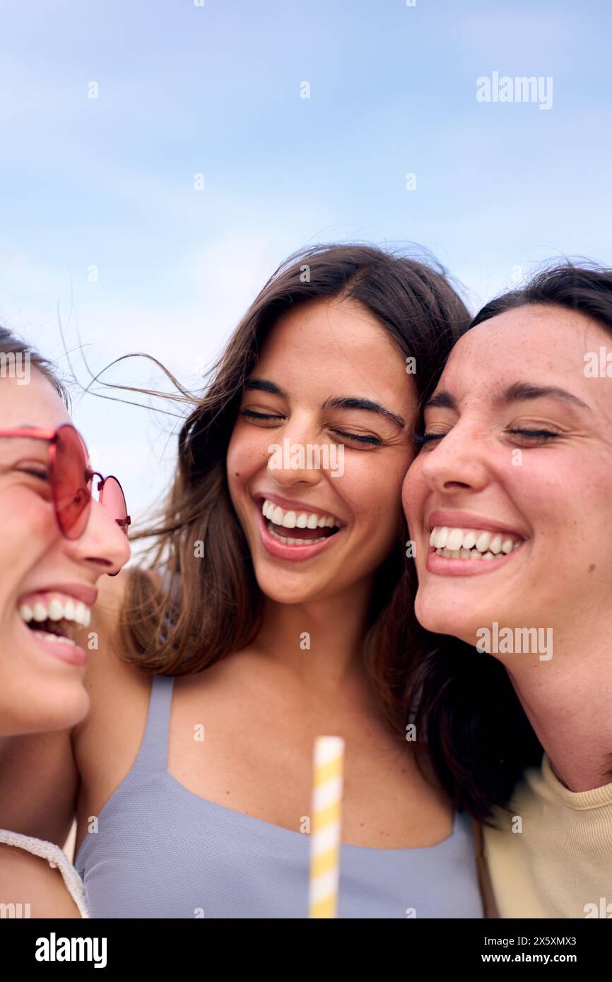 Portrait of group of beautiful laughing gen z European women. Three ...