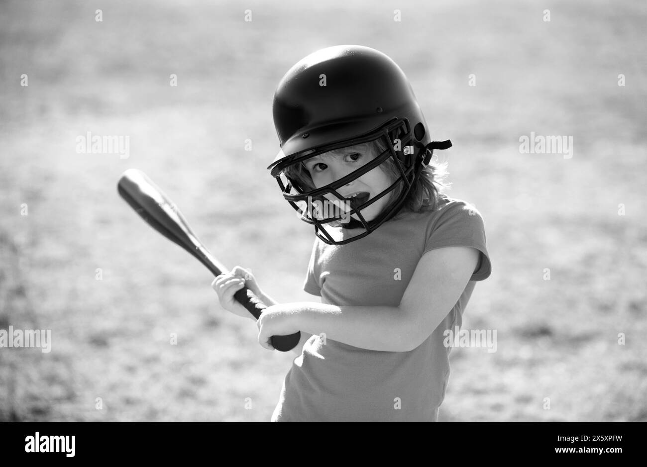 Funny boy kid holding a baseball bat. Pitcher child about to throw in ...