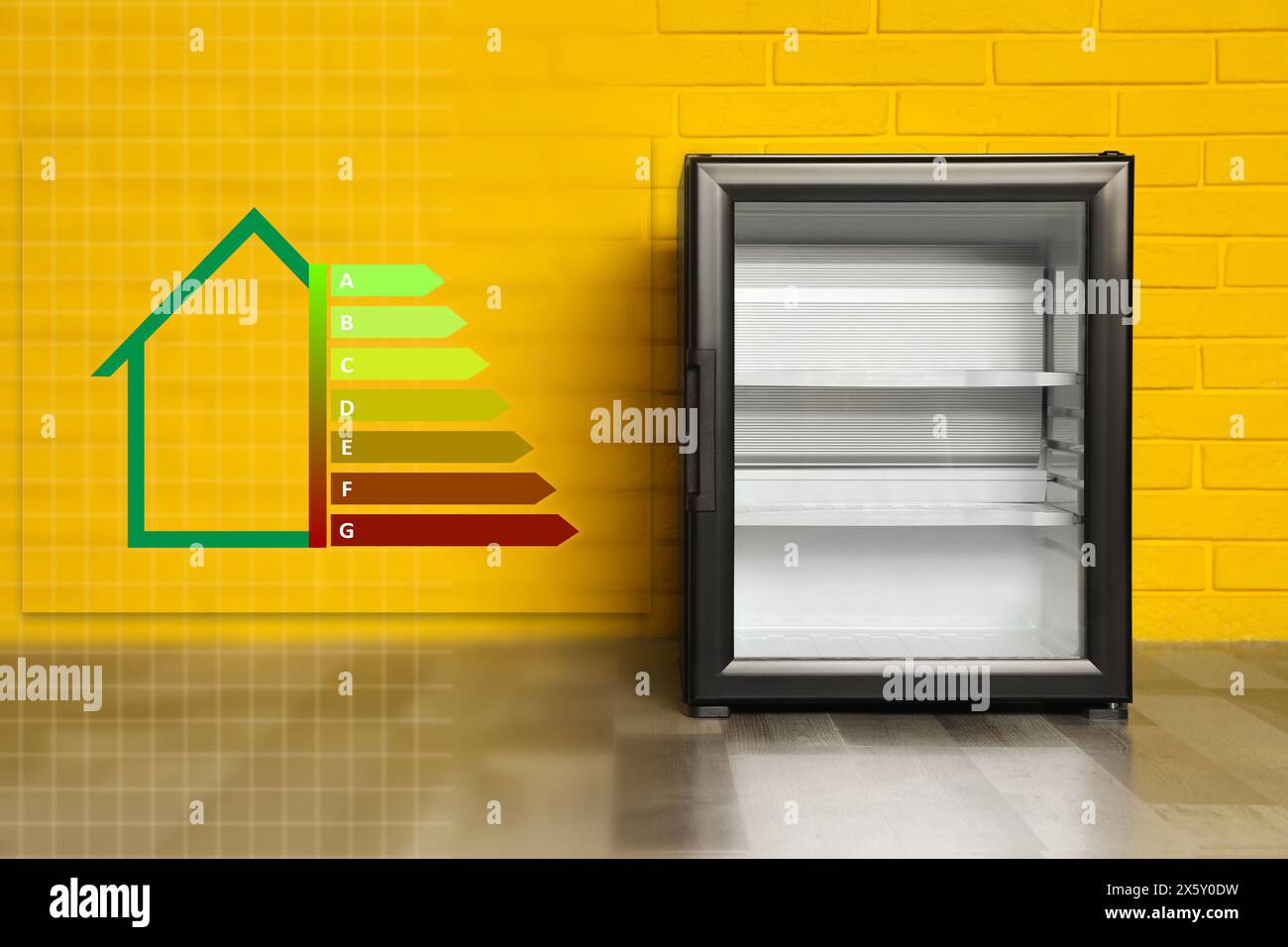 Energy efficiency rating label and refrigerator indoors Stock Photo - Alamy