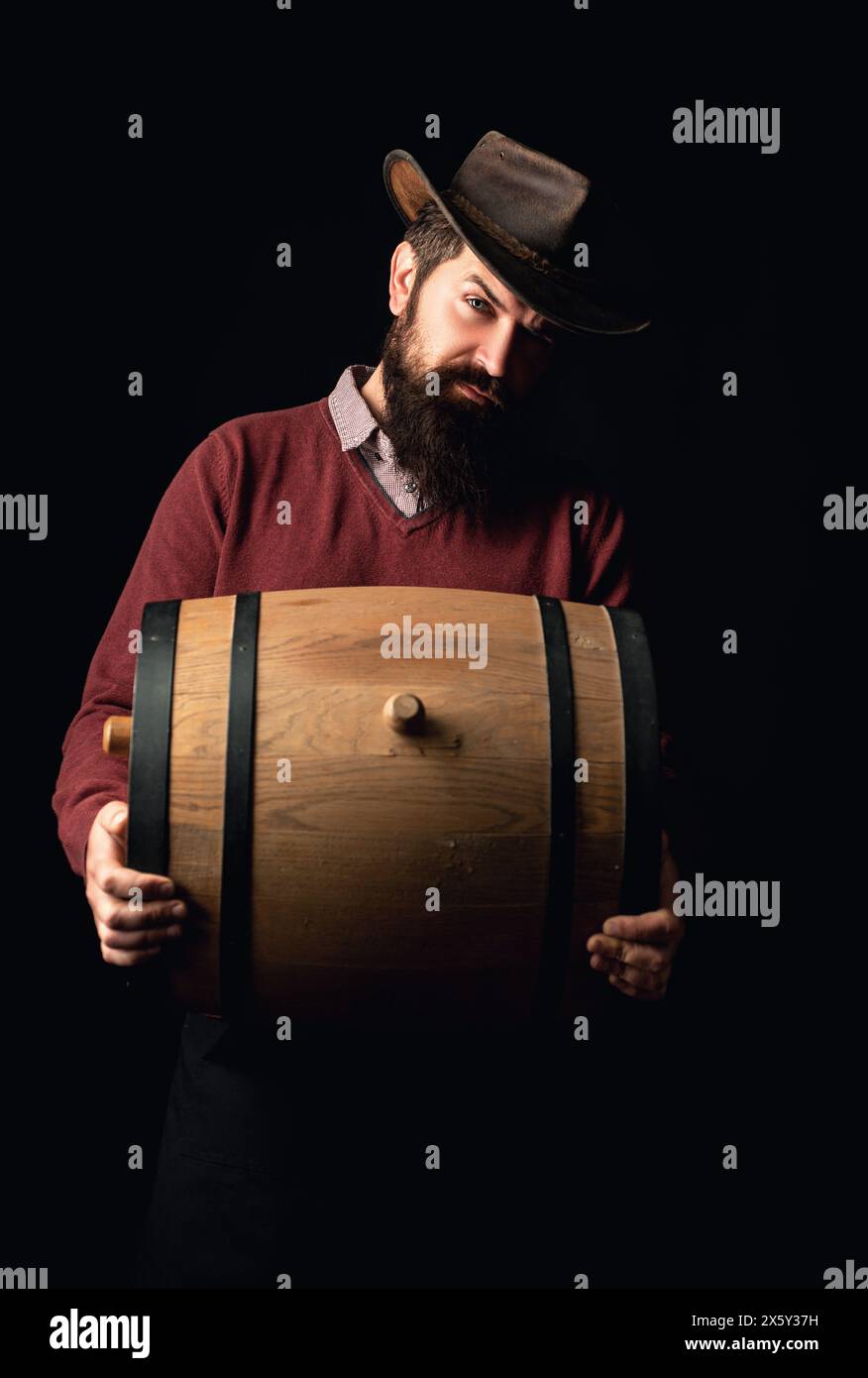 Man hold wooden barrel on black. Oktoberfest. Bearded brewer man ...