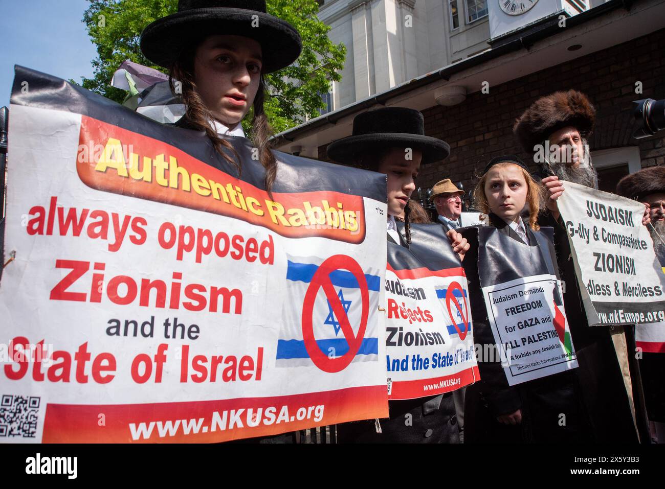 London, UK. 11th May, 2024. Haredi Jewish protesters wear banners ...