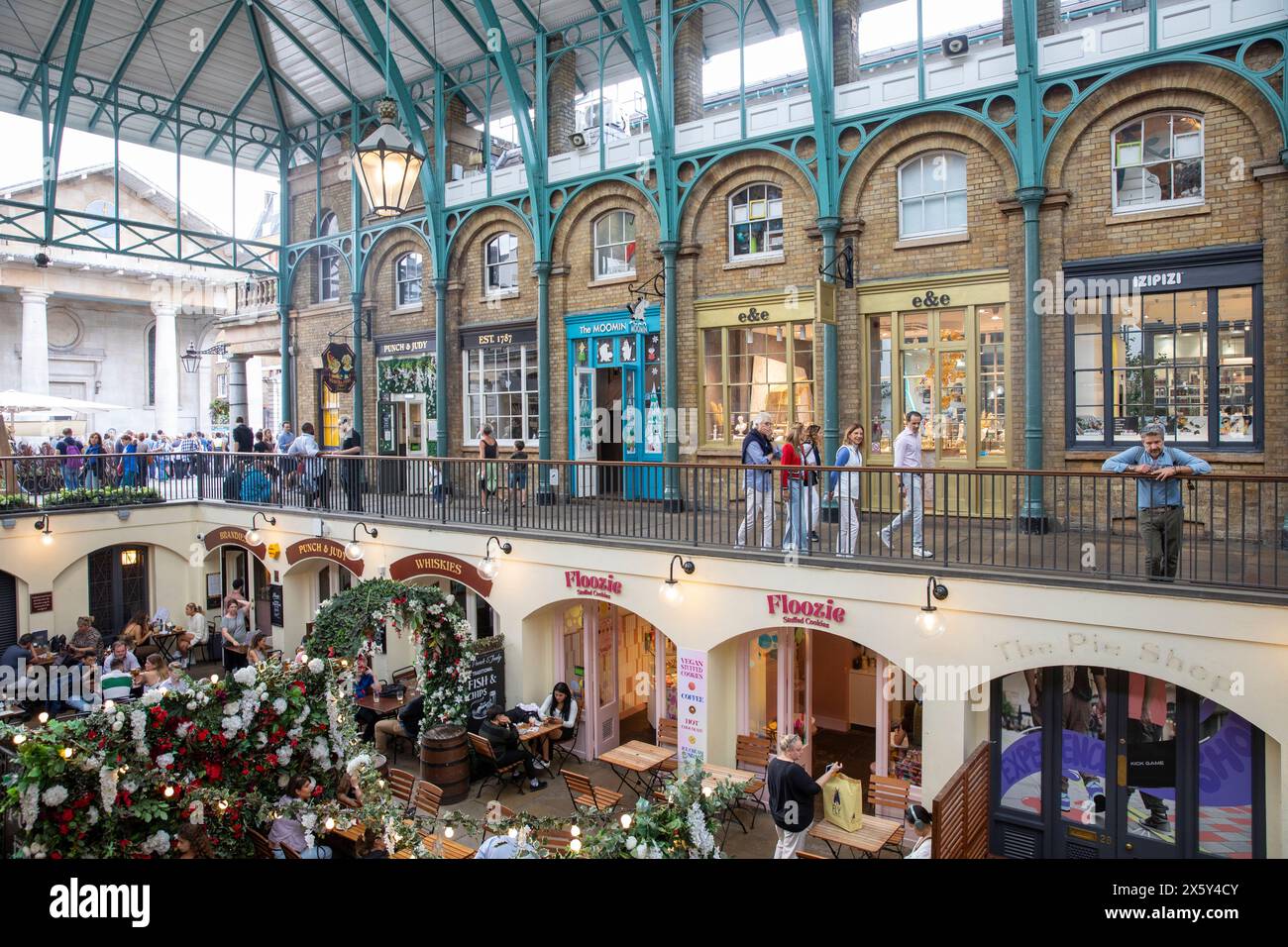 Covent Garden London market interior, shops and stores across two ...