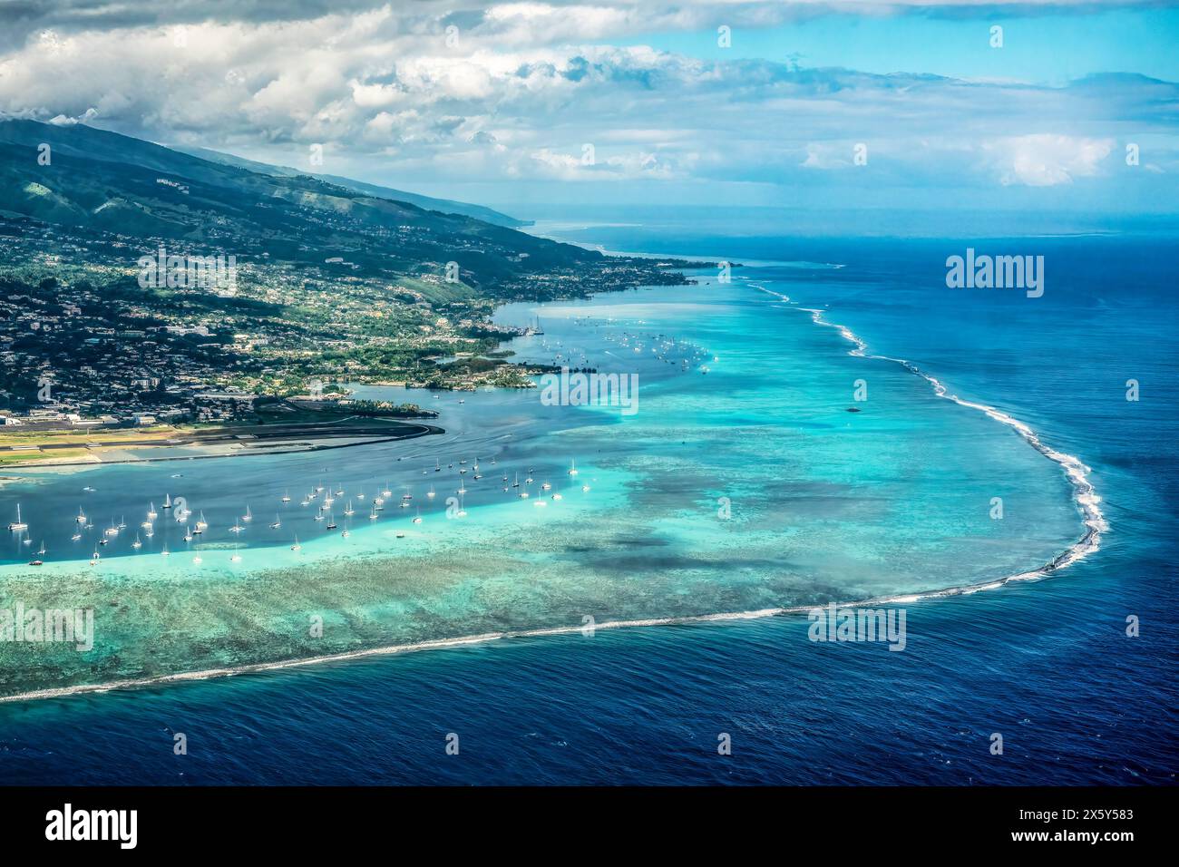 Aerial view of Papeete and its coral reef, the capital of French Polynesia on the island of ...