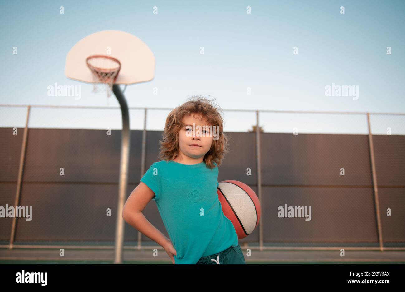 Kid boy child concentrated on playing basketball Stock Photo - Alamy
