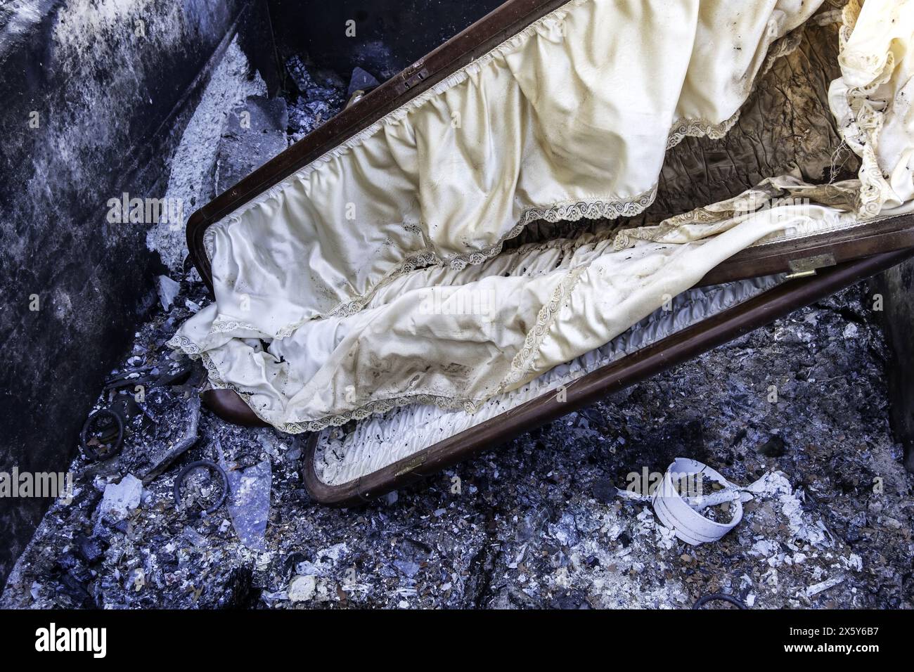 Burnt coffin wit0h flowers in cemetery, religion and burial Stock Photo ...