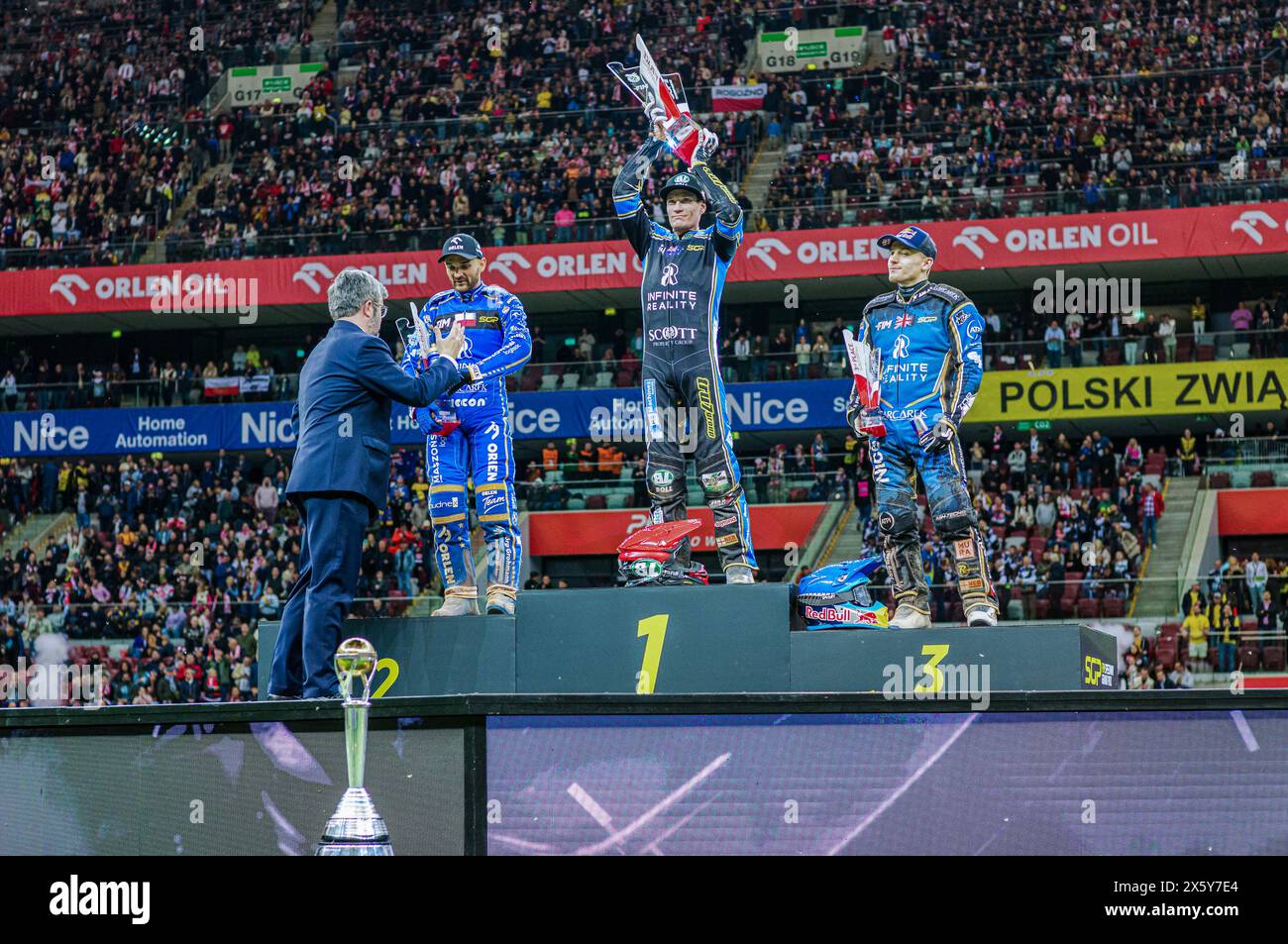 Australian rider Jason Doyle holds the 1st place trophy aloft during ...