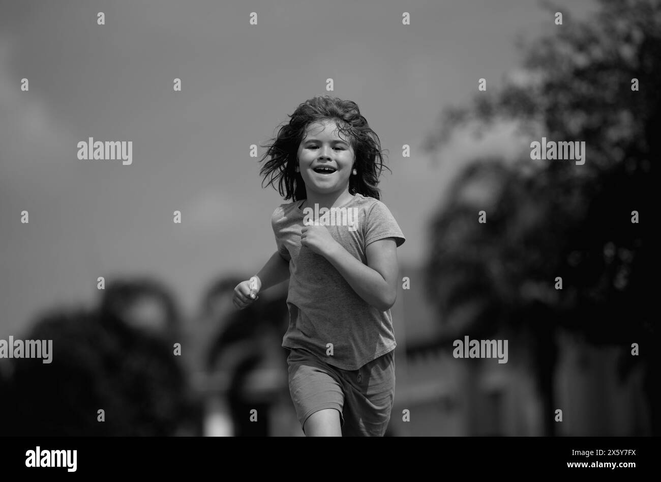 Child running in summer street. Kid enjoy run. Kid running on ...