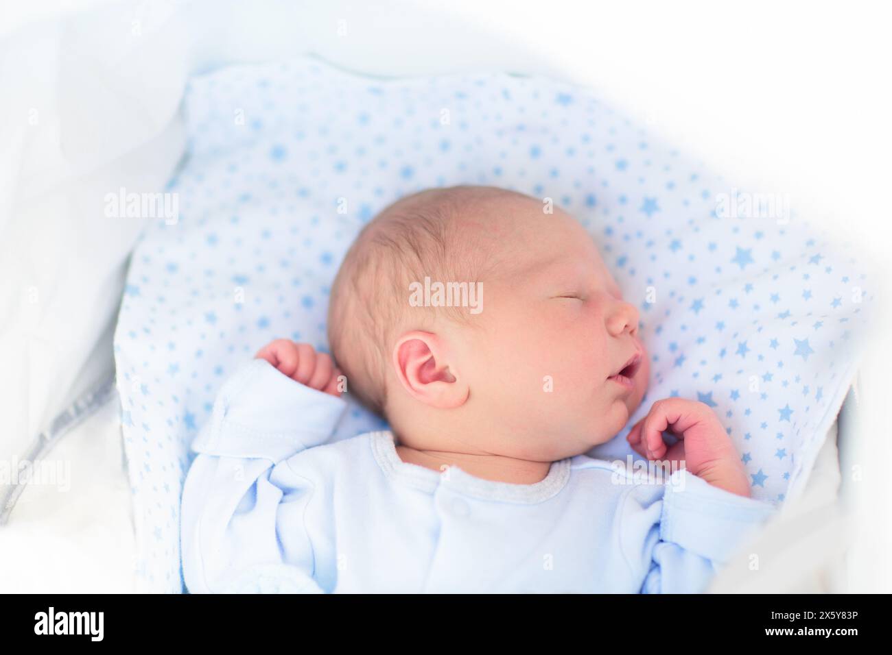 Newborn baby sleeping in white stroller on a walk in summer park. New ...