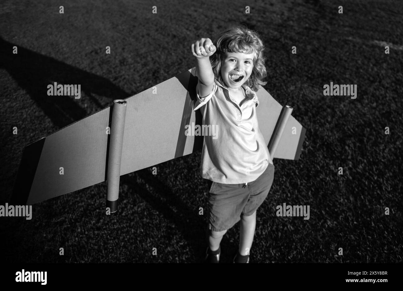 Kid superhero with jetpack. Child pilot play on summer day. Success ...