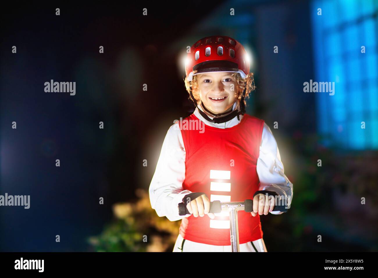 Kid in reflective vest in darkness. Safety on dark city streets for ...