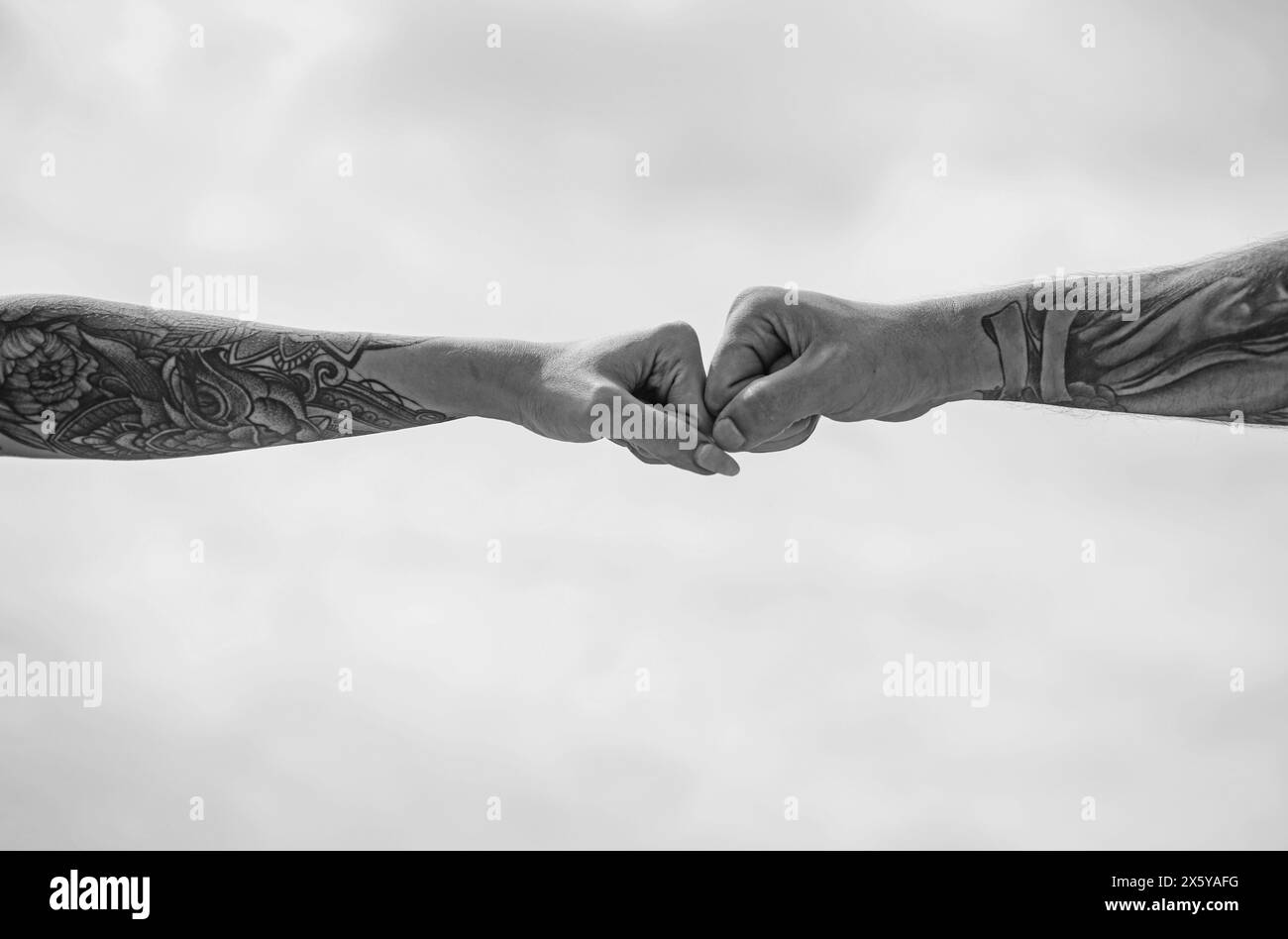 Couple hands with tattoo. Helping hand. Holding hand, close up. Giving ... Couple hands with tattoo. Helping hand. Holding hand, close up. Giving ...
