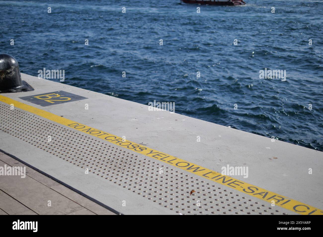 yellow caution sign or line on the platform Stock Photo - Alamy