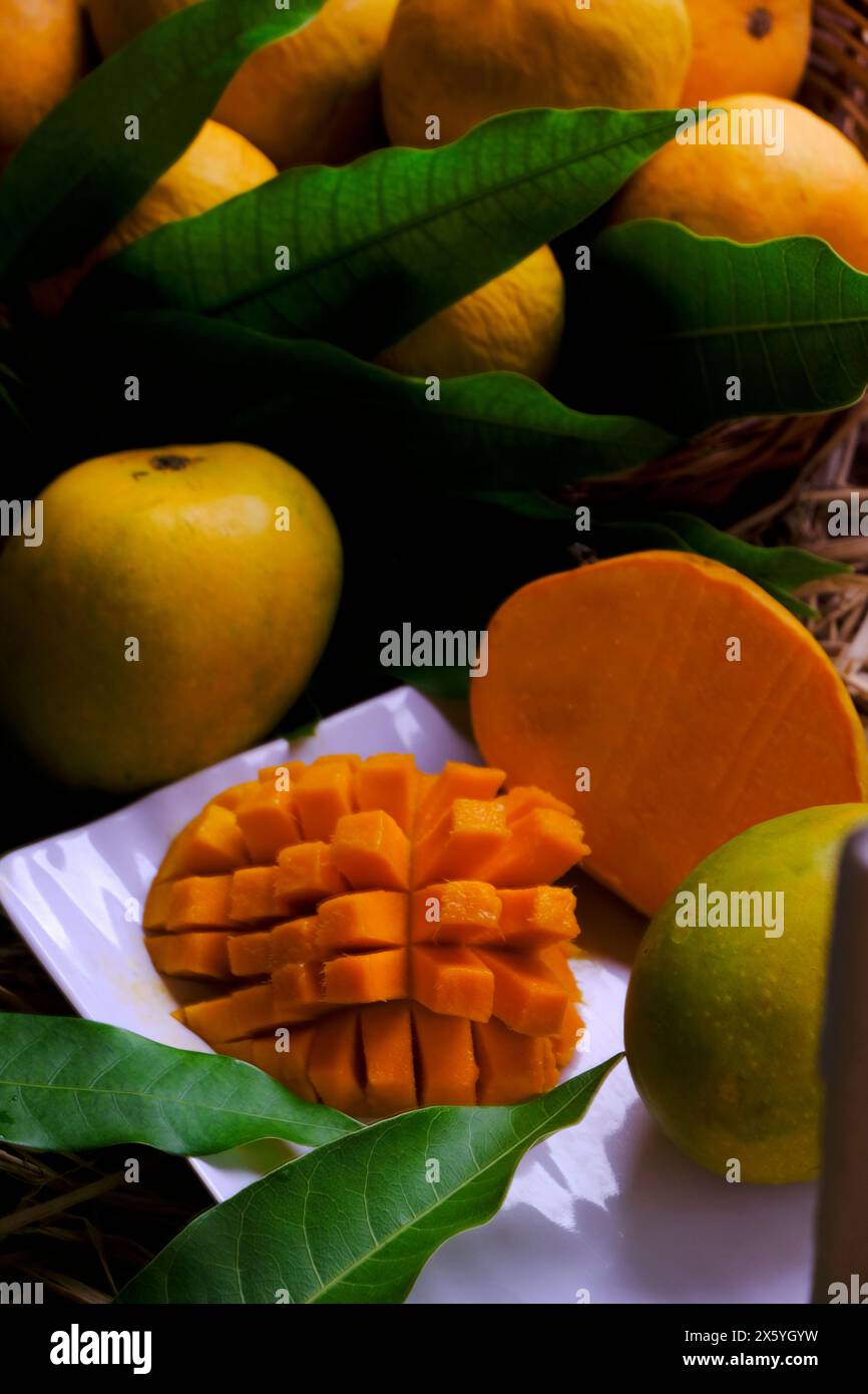 Mango tropical fruit with green leaf, Ripe mango in grass closeup, Cut ...