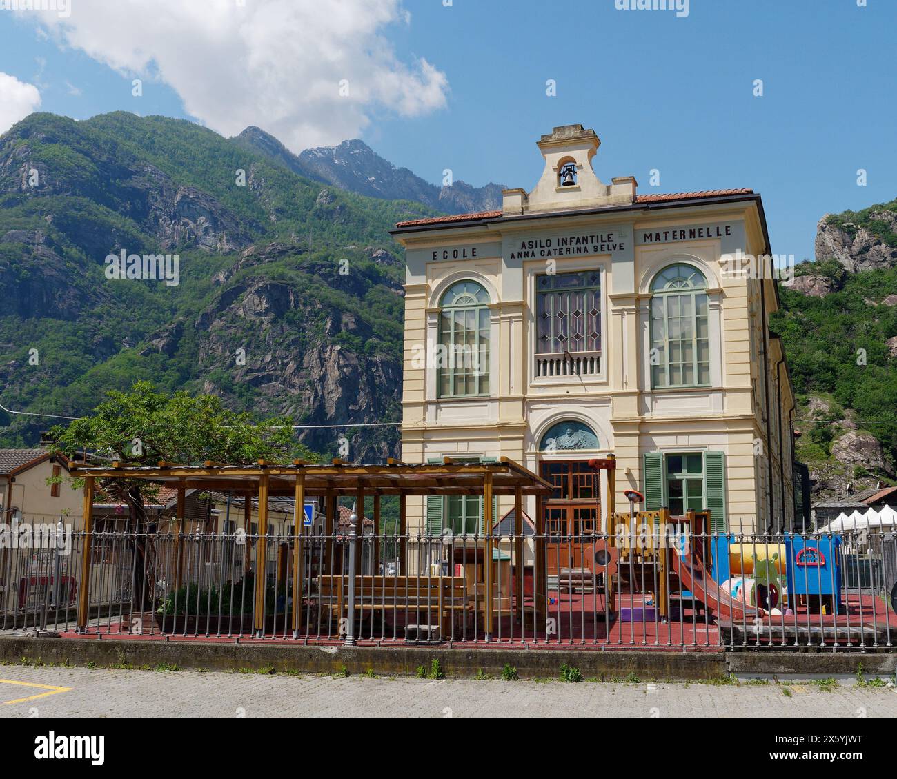 Large elegant school building in the town of Donnas with playground and ...