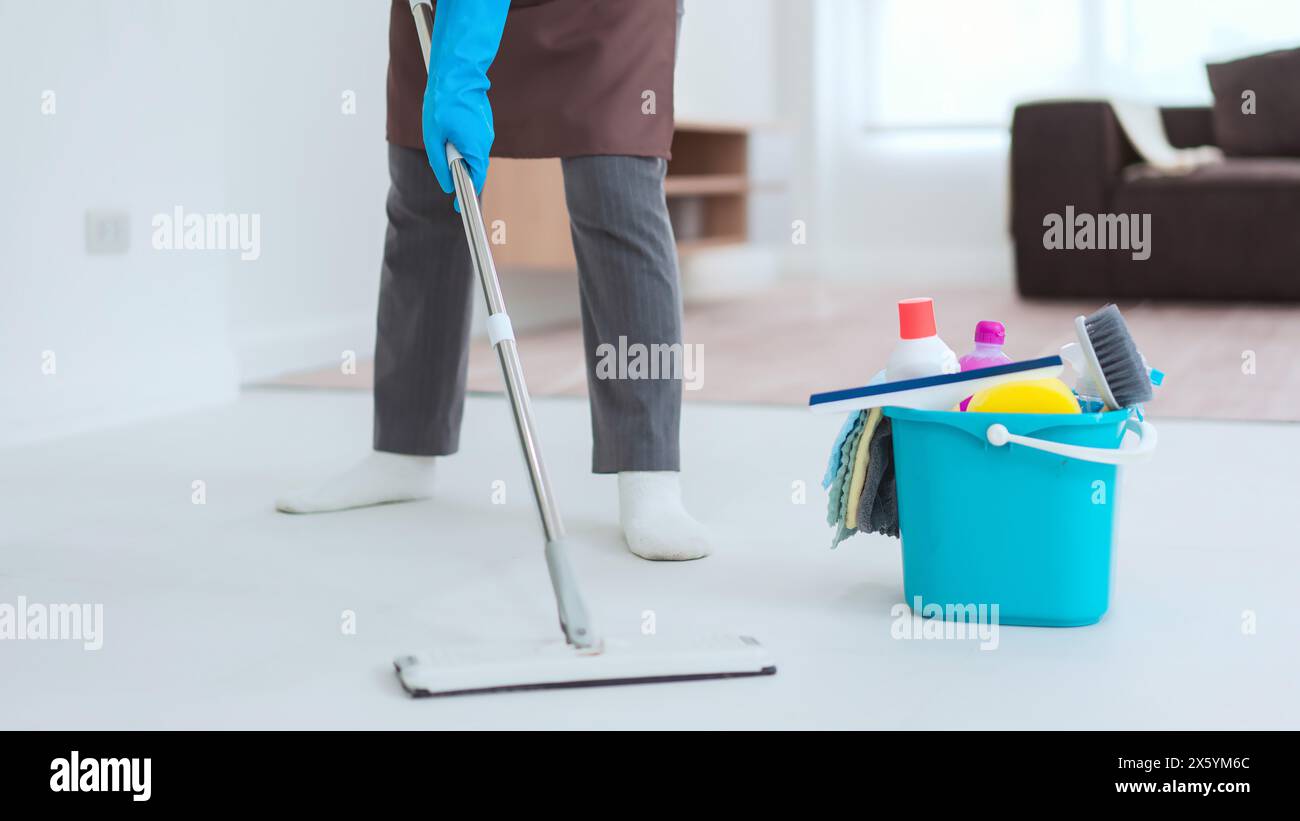 Housewife mopping floor in living hi-res stock photography and images ...