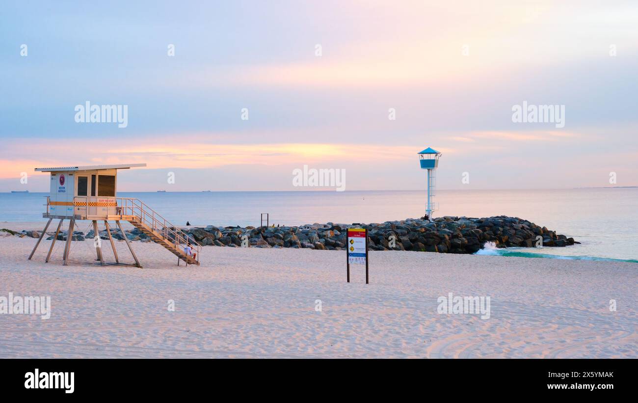 Surf life saving station, beach sign and lookout tower on groyne at ...