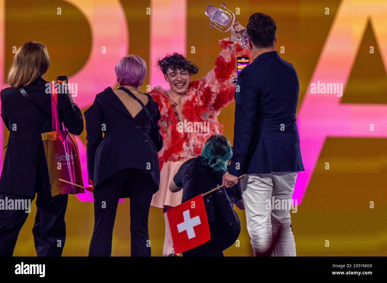 12 May 2024, Sweden, Malmö: Nemo from Switzerland celebrates after ...