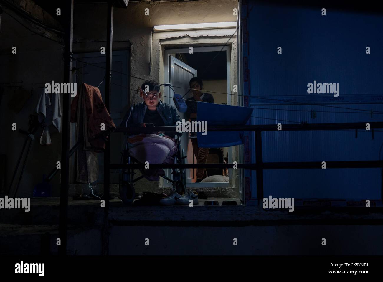 Onur takes air on the roof of his house at night. Onur Kaba is a 22 ...