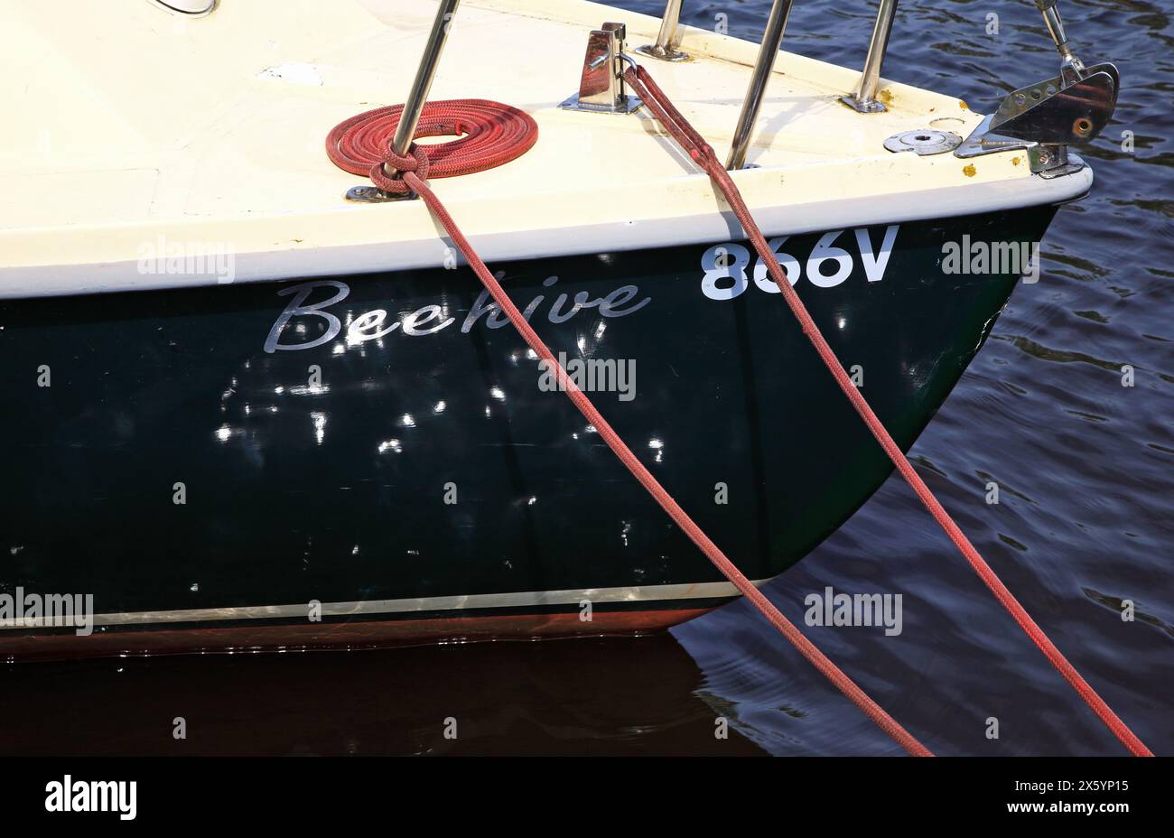 The bow of a sailboat with mooring ropes tied-up in Pleasure Boat Dyke ...