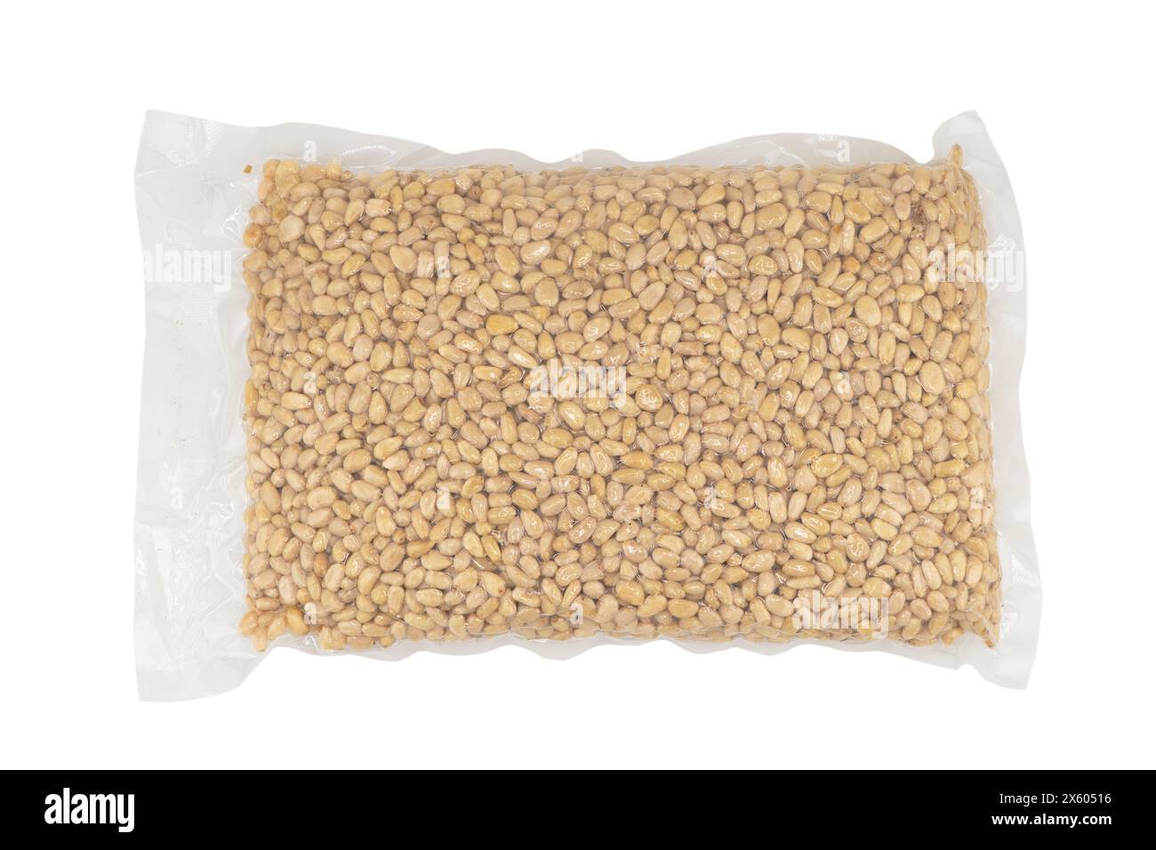Cedar nuts in plastic bag isolated on white background. Transparent ...