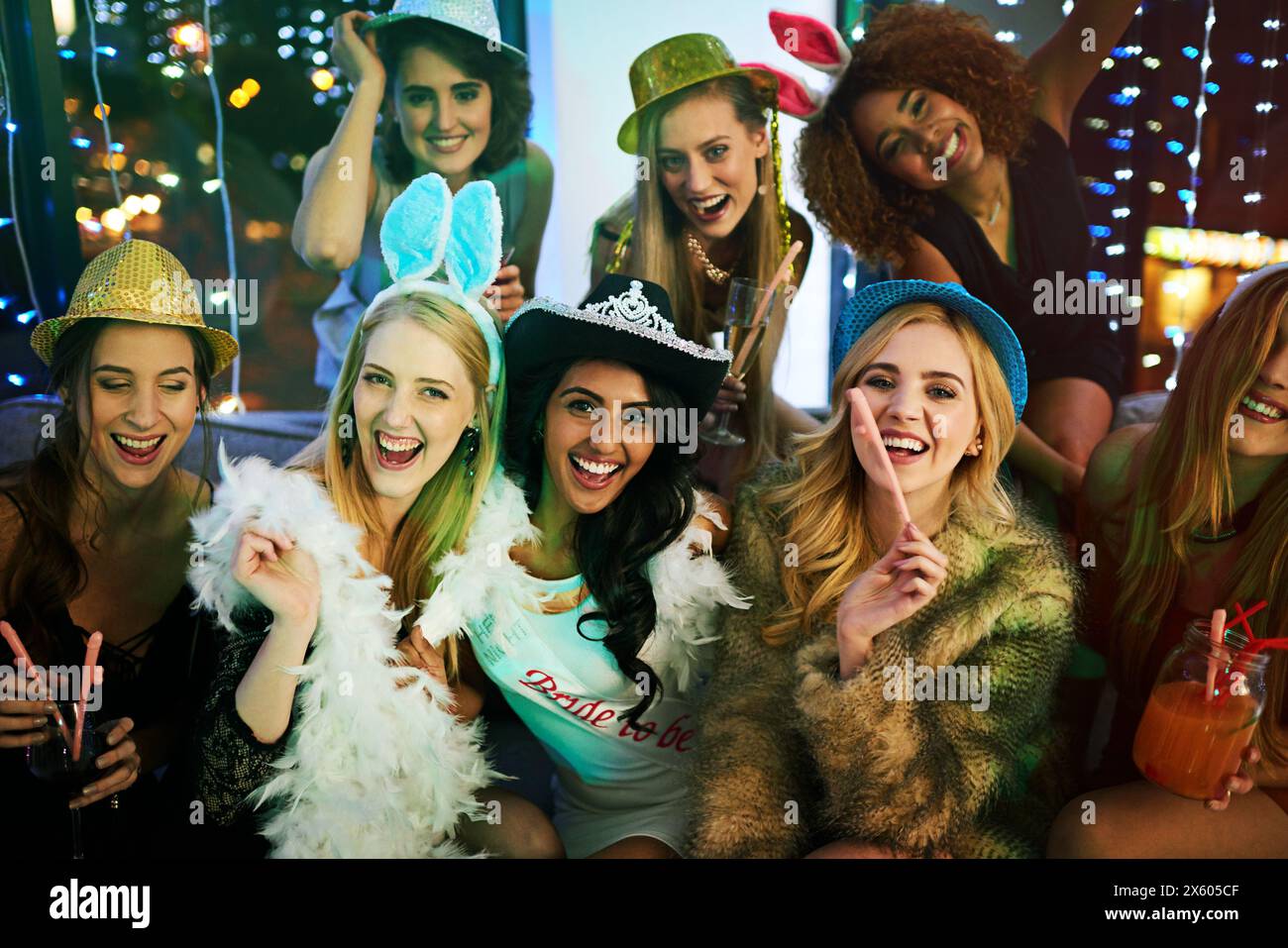 Group, women and bachelorette party in nightclub and happy for friend ...