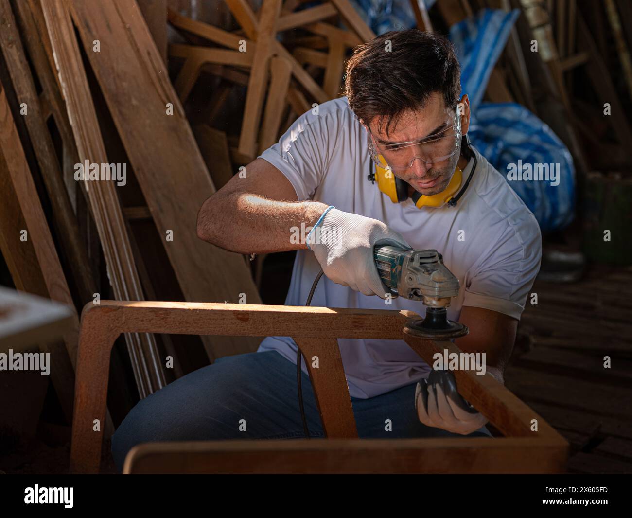 Professional Carpenter happy working to making woodcraft furniture in ...