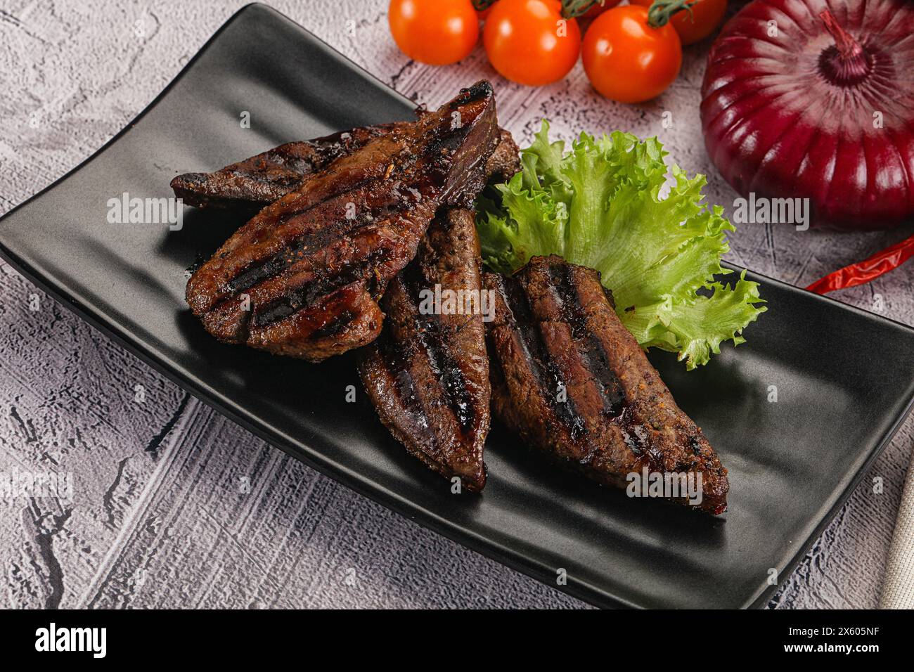 Grilled diet beef liver steak in the plate Stock Photo - Alamy